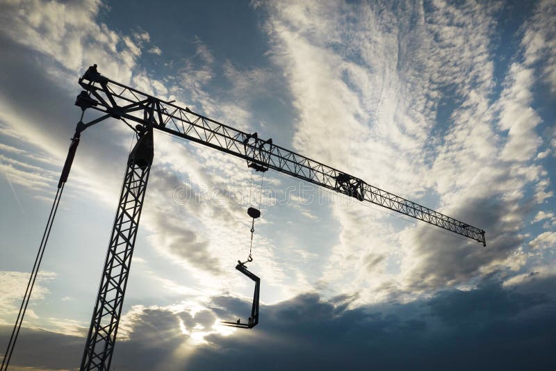 The Profile of a Construction Crane at Sunset Stock Photo - Image of ...
