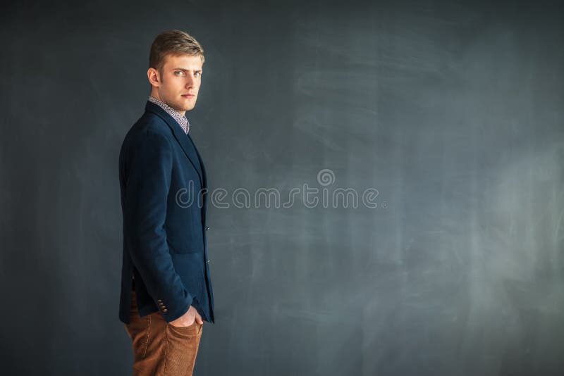 Profile Of Handsome Man Standing Against Grey Wall Background Stock ...