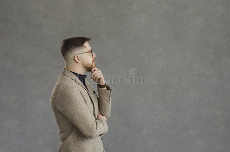Side View of Young Businessman Thinking and Looking at Copy Space on ...