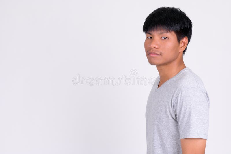 Profile View of Young Asian Man Looking at Camera Stock Photo - Image ...