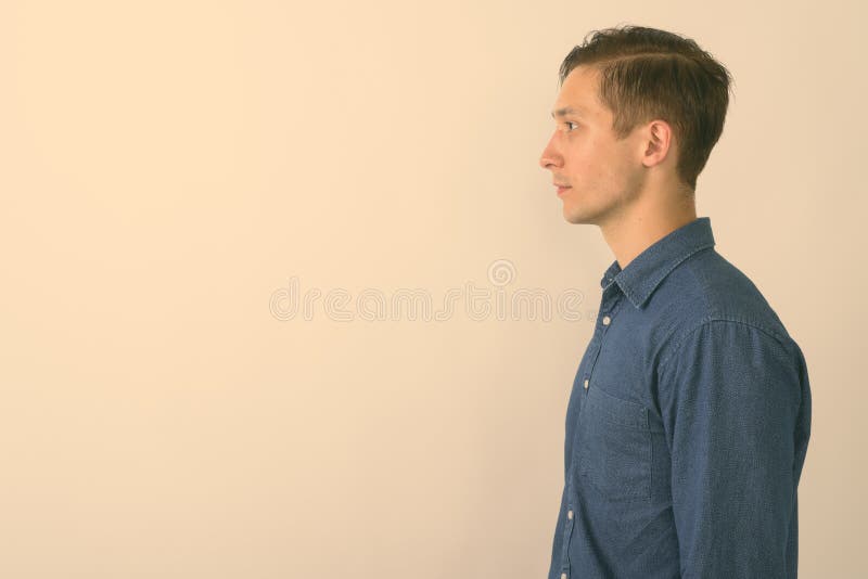 Profile View of Young Handsome Man Against White Background Stock Image ...