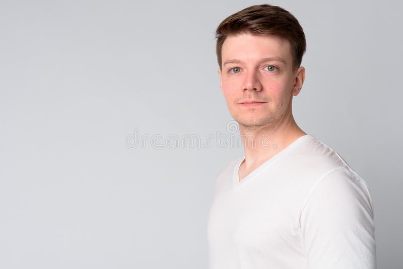 Profile View of Young Handsome Man Looking at Camera Stock Photo ...