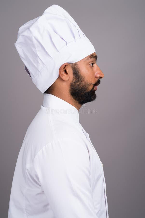 Profile View of Young Indian Man Chef Against Gray Background Stock ...
