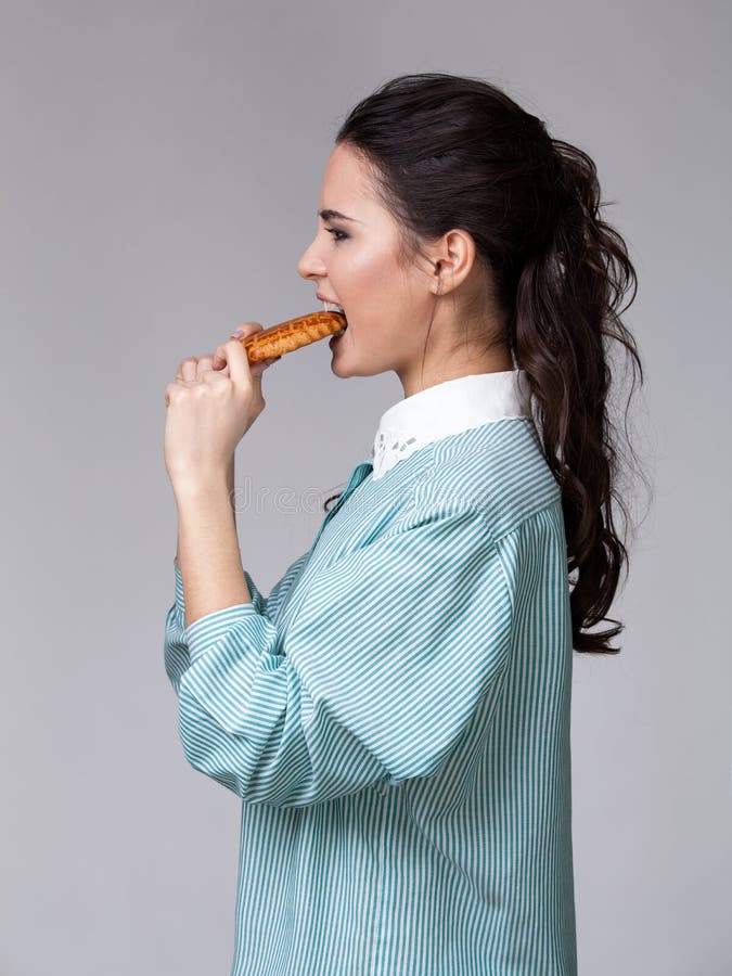 Profile of a Woman with a Bisquit Stock Photo - Image of junk, lunch ...