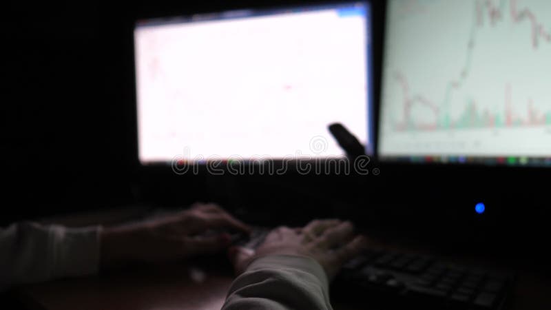 Profile of Young Financial Analyst Working on Computer with Multi ...