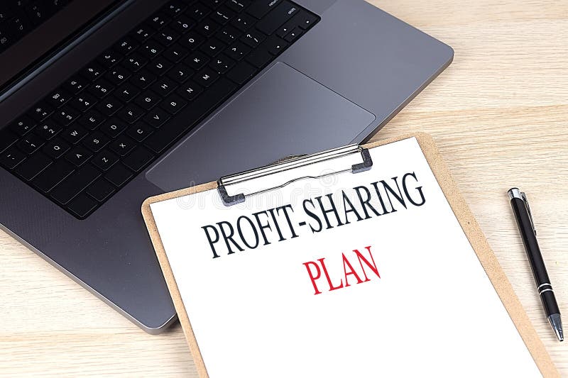 Profit-sharing Plan Document on a Clipboard with a Laptop and Pen on a ...
