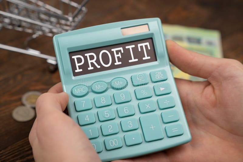 PROFIT Text on a Calculator with Keyboard and Coffee. Stock Image ...
