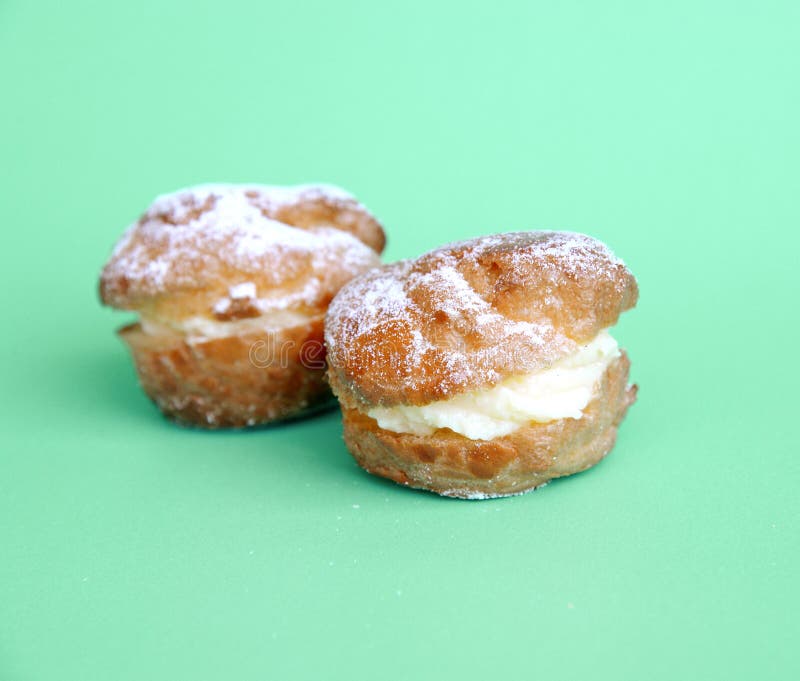 Profiterole or Cream Puff with Filling and Powdered Sugar Topping Stock ...