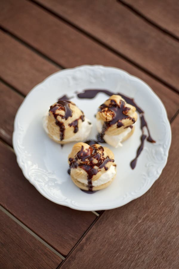 Profiteroles stock image. Image of chocolate, sauce, plate - 17119721