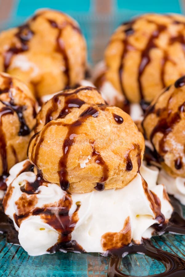 Profiteroles stock image. Image of puff, sauce, garnished - 84633447