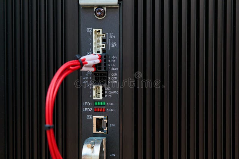 Programmable Logic Controller with Red Cable Connecting To Input Output ... Programmable Logic Controller with Red Cable Connecting To Input Output ...