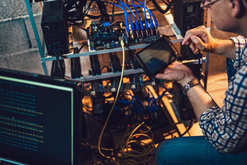 Programmer Adjusting Cryptocurrency Mining Rig Stock Photo - Image of ...