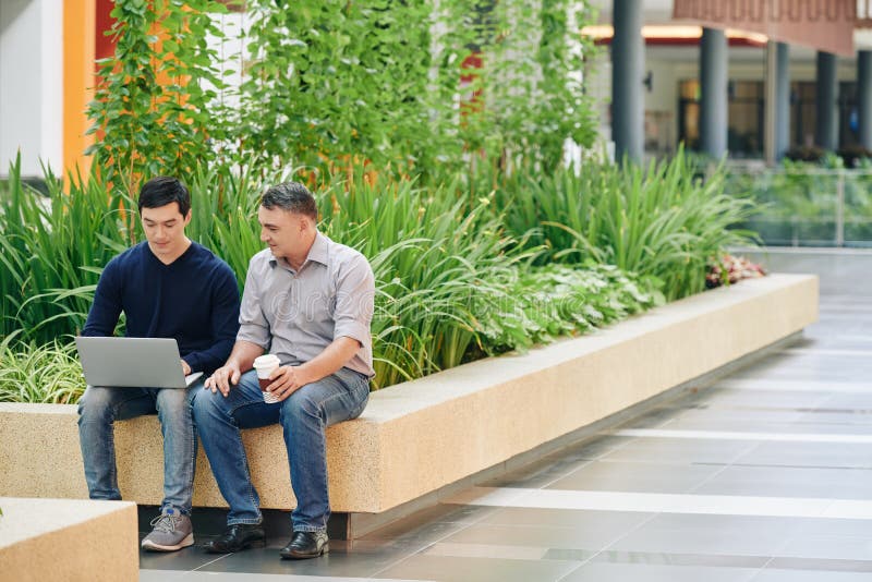 Programmer Asking Colleague for Help Stock Photo - Image of laptop ...