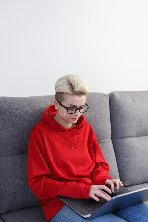 Programmer Coding on Laptop at Home. Short Haired Tom Boy Female Typing ...