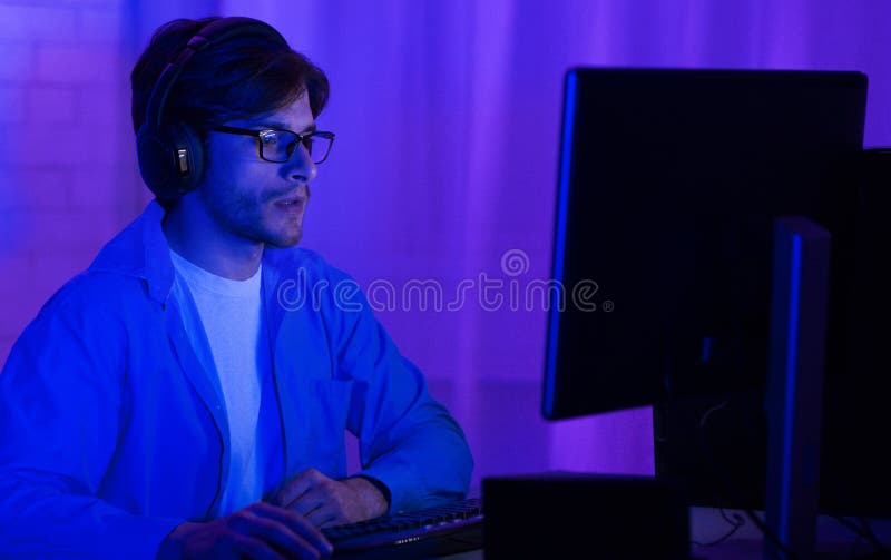 Programmer in Eyeglasses Coding on PC at Home, Low Light Stock Photo ...