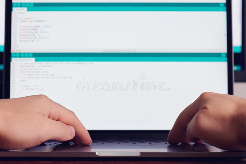 The Programmer`s Hands are Analyzing Some Systems while Drinking Coffee on the Desk. Stock Image ...