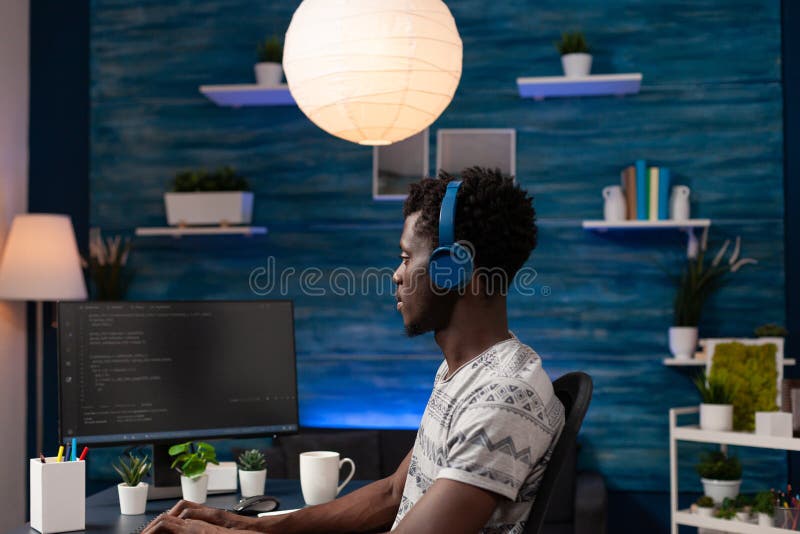 Programmer Man Wearing Headphones Typing Binary Code for Website ...
