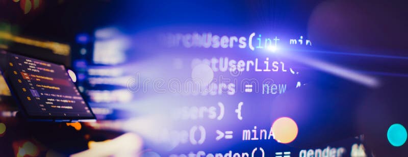 Programmer Manually Working With Program Code On A Computer At Night In A Data Center And