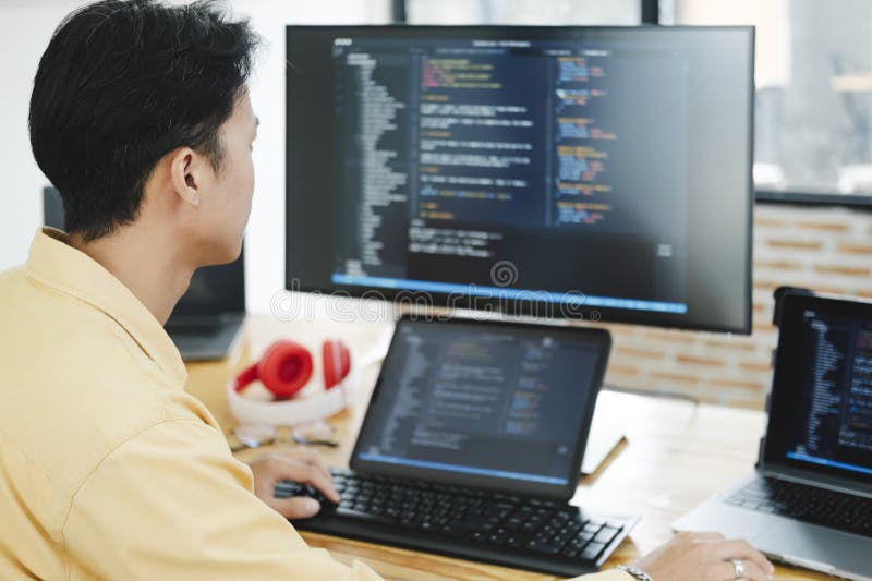 It Programmer Starts Working on Desktop Computer. Stock Photo - Image ... It Programmer Starts Working on Desktop Computer. Stock Photo - Image ...