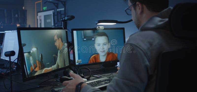 Programmer Talking with a Boy Via a VoIP Call Stock Image - Image of ...
