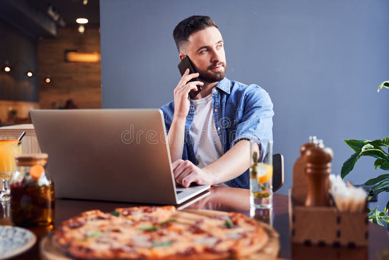 Programmer Talking on Telephone and Eating Pizza Stock Photo - Image of ...