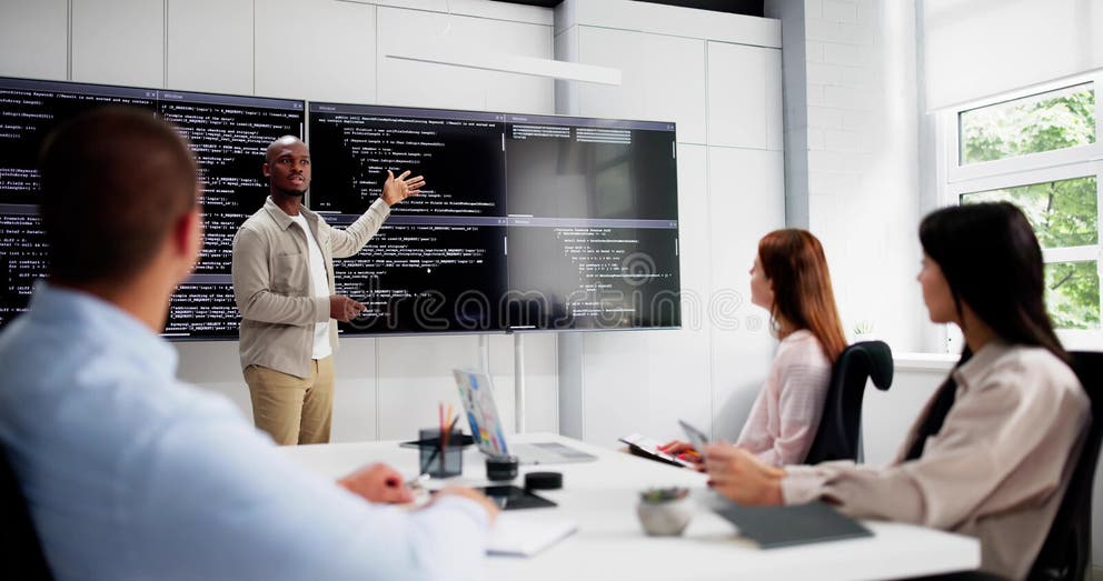 Programmer Team Meeting with TV Screen in Office Stock Photo - Image of ...