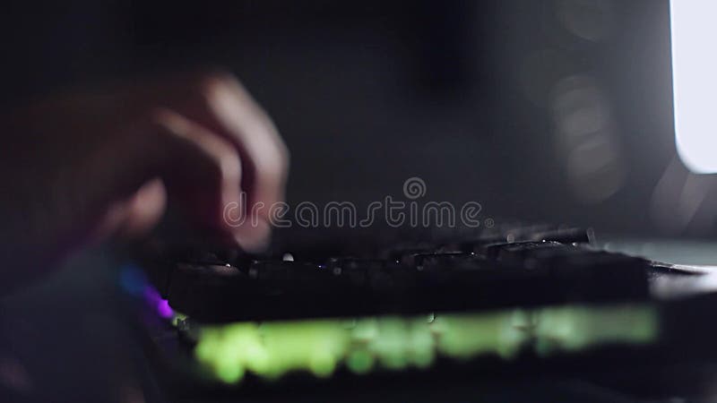 Programmer Typing Code on a Backlit Keyboard in a Dark Room, Passionate ... Programmer Typing Code on a Backlit Keyboard in a Dark Room, Passionate ...