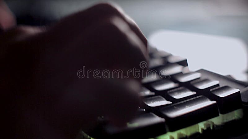 Programmer Typing Code on a Backlit Keyboard in a Dark Room, Passionate ... Programmer Typing Code on a Backlit Keyboard in a Dark Room, Passionate ...