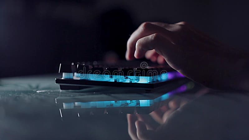 Programmer Typing Code on Backlit Keyboard, Development and Hacking. Men`s Hands Quickly Type on ...