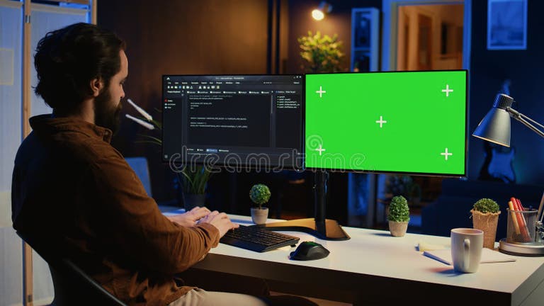 Programmer Typing Complex Code on Green Screen Computer in Neon Lit ...