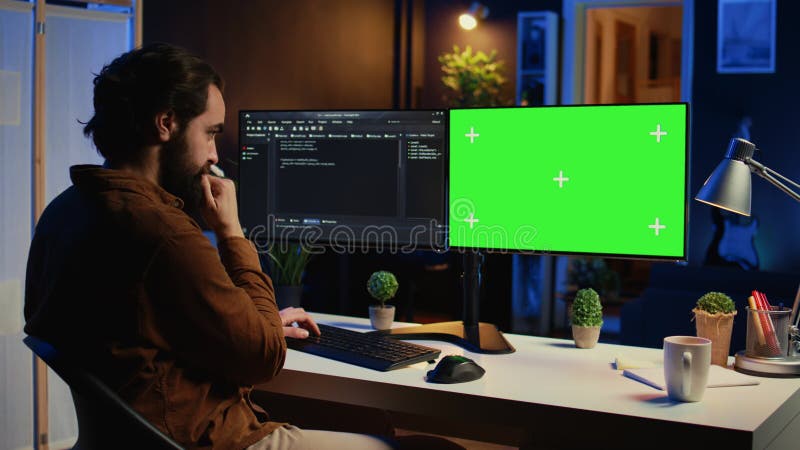 Programmer Typing Complex Code on Green Screen Computer in Neon Lit ... Programmer Typing Complex Code on Green Screen Computer in Neon Lit ...