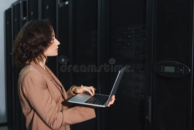 Programmer Using Laptop while Checking Servers Stock Image - Image of ...