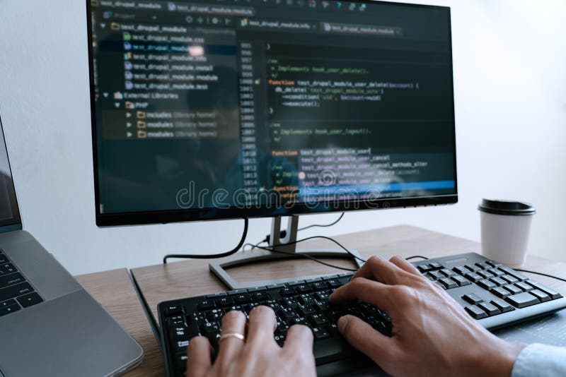 Programmer Working On Computer In It Office Typing Data Coding In Software And Checking Code On