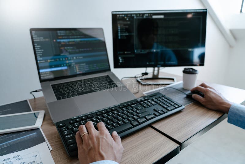 Programmer Working On Computer In It Office Typing Data Coding In Software And Checking Code On