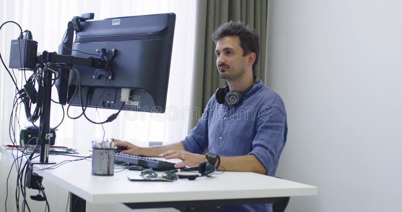 Programmer Working on Computer in it Office Typing Data Stock Footage ...