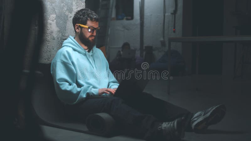 Programmer Working in Dark Bomb Shelter Stock Photo - Image of laptop ...