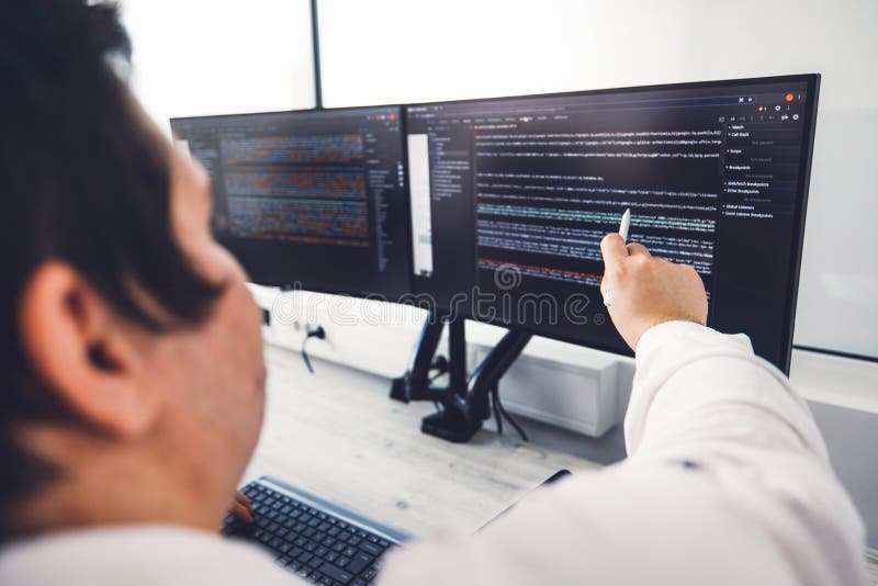 Close Up Over The Shoulder View Unrecognizable Man Programmer Coding Pointing At Something On