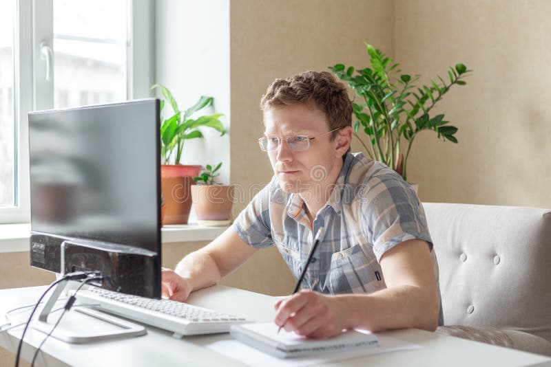 Programmer Working from Home, Remote, Home Office. a Man with Glasses ...