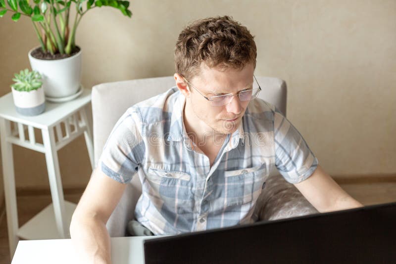 Programmer Working from Home, Remote, Home Office. a Man with Glasses ...