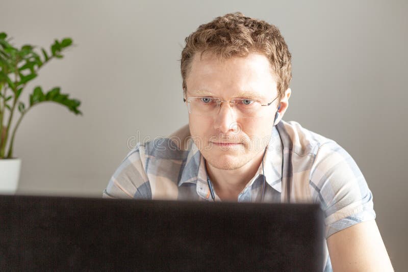 Programmer Working from Home, Remote, Home Office. a Man with Glasses ...