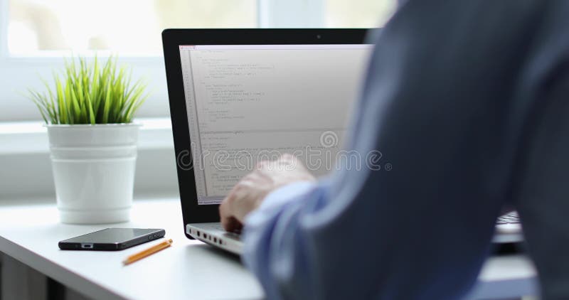 Programmer Working on Laptop in Office Writing Programming Code Stock ... Programmer Working on Laptop in Office Writing Programming Code Stock ...