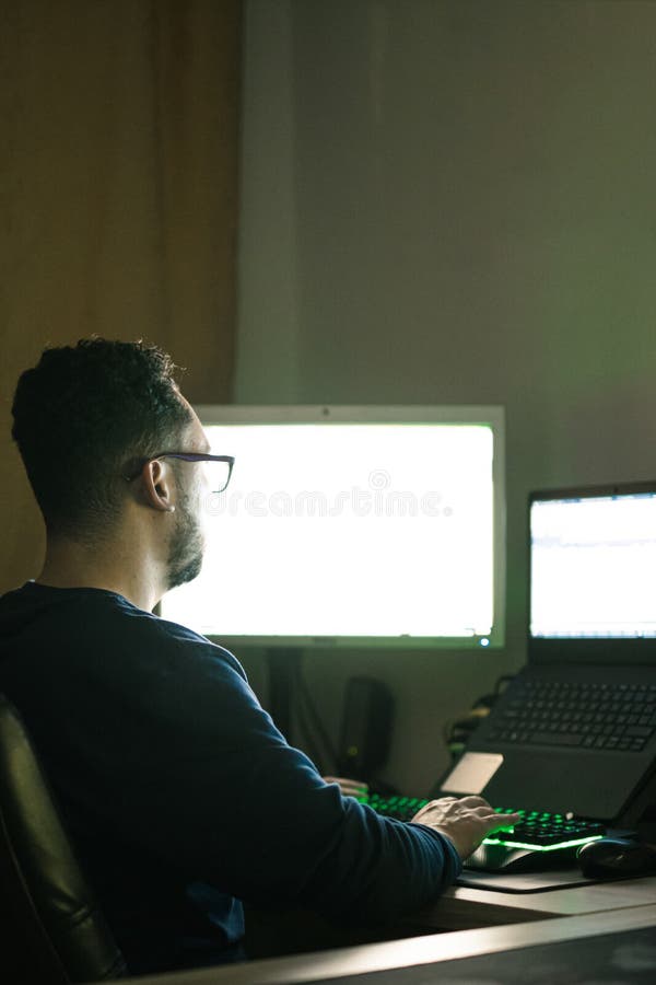 Programmer Working Remotely from Home and Developing Web Pages at Night ...