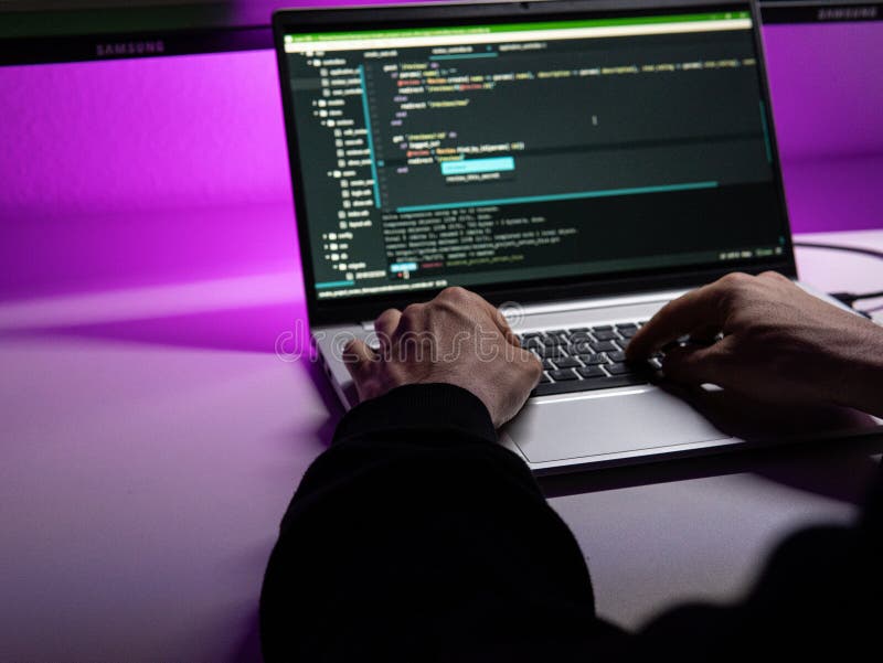 The Programmer Works in His Home Office. in the Dark with Backlight ...