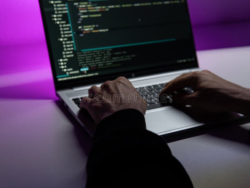 The Programmer Works in His Home Office. in the Dark with Backlight ...