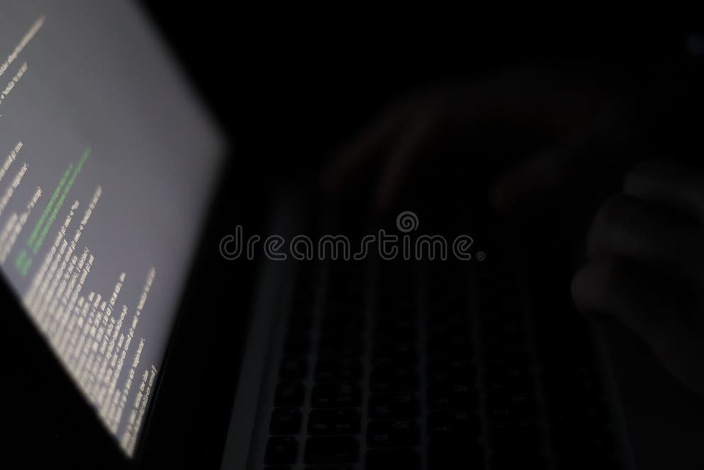 The Programmer Writes the Program Code at Night in a Dark Room. Hands ...
