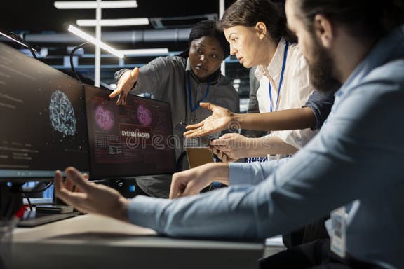 Programmers in AI Data Center React To Virus Alert, Protecting Critical Systems Stock Image ...