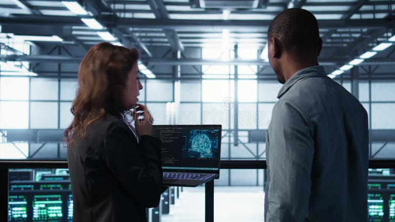 Programmers Coding on Laptop Using Artificial Intelligence in Server ...