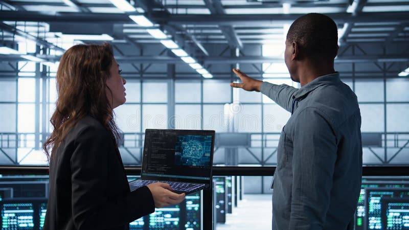 Programmers Coding on Laptop Using Artificial Intelligence in Server Farm Stock Image - Image of ...