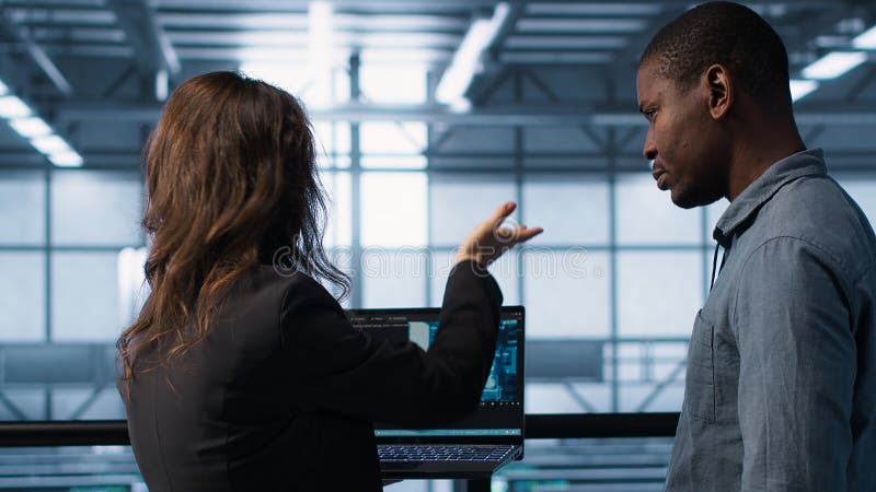 Programmers Coding on Laptop Using Artificial Intelligence in Server Farm Stock Photo - Image of ...