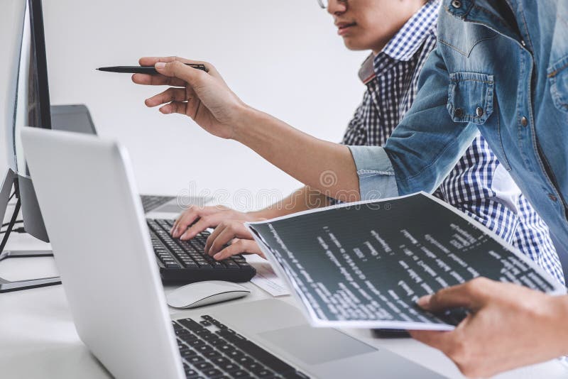 Two Professional Programmers Cooperating at Developing Programming and Website Working in a ...